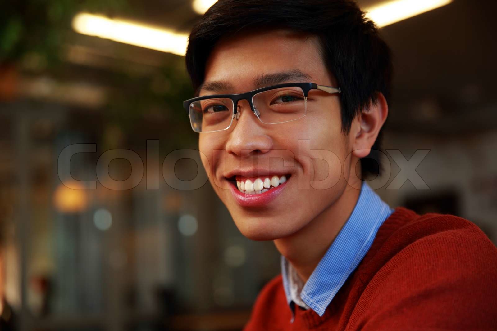Closeup portrait of a young smiling asian man with glasses | Stock ...