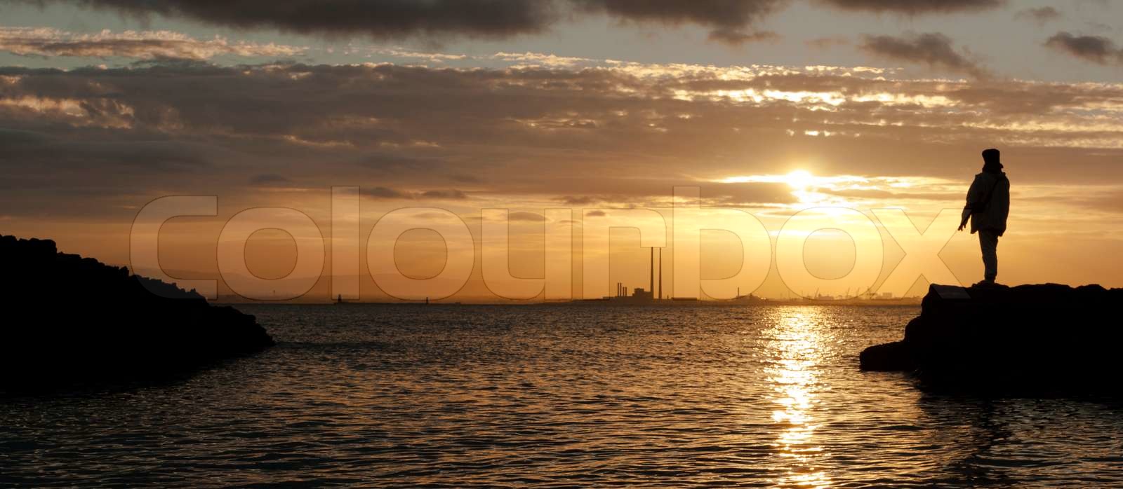 Sunset with human silhouette | Stock image | Colourbox