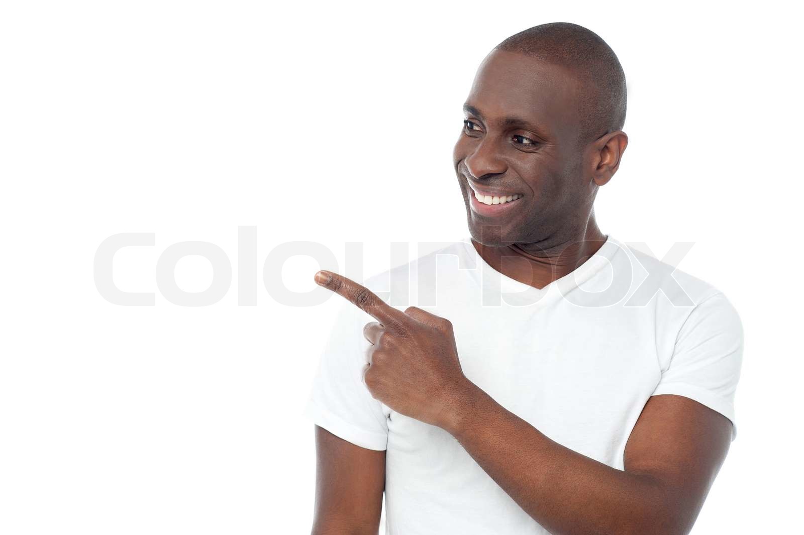 Happy man pointing at something | Stock image | Colourbox