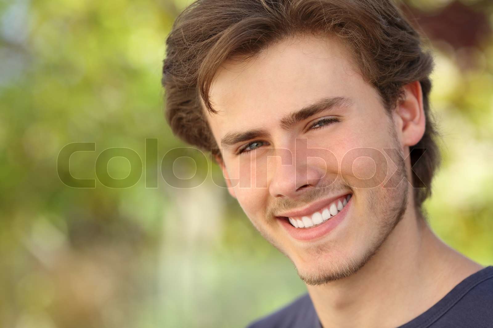 Handsome man face with a white perfect smile | Stock image | Colourbox
