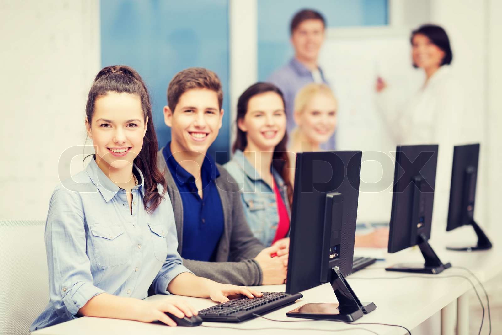 students with computer monitor at school | Stock image | Colourbox