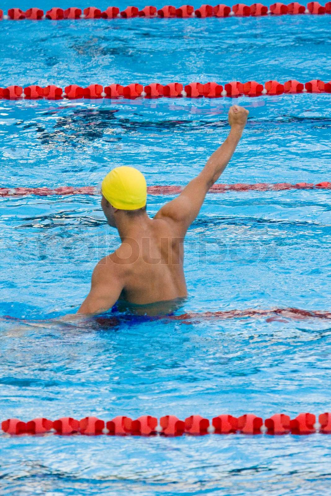 A male winner of a swimming competition | Stock image | Colourbox
