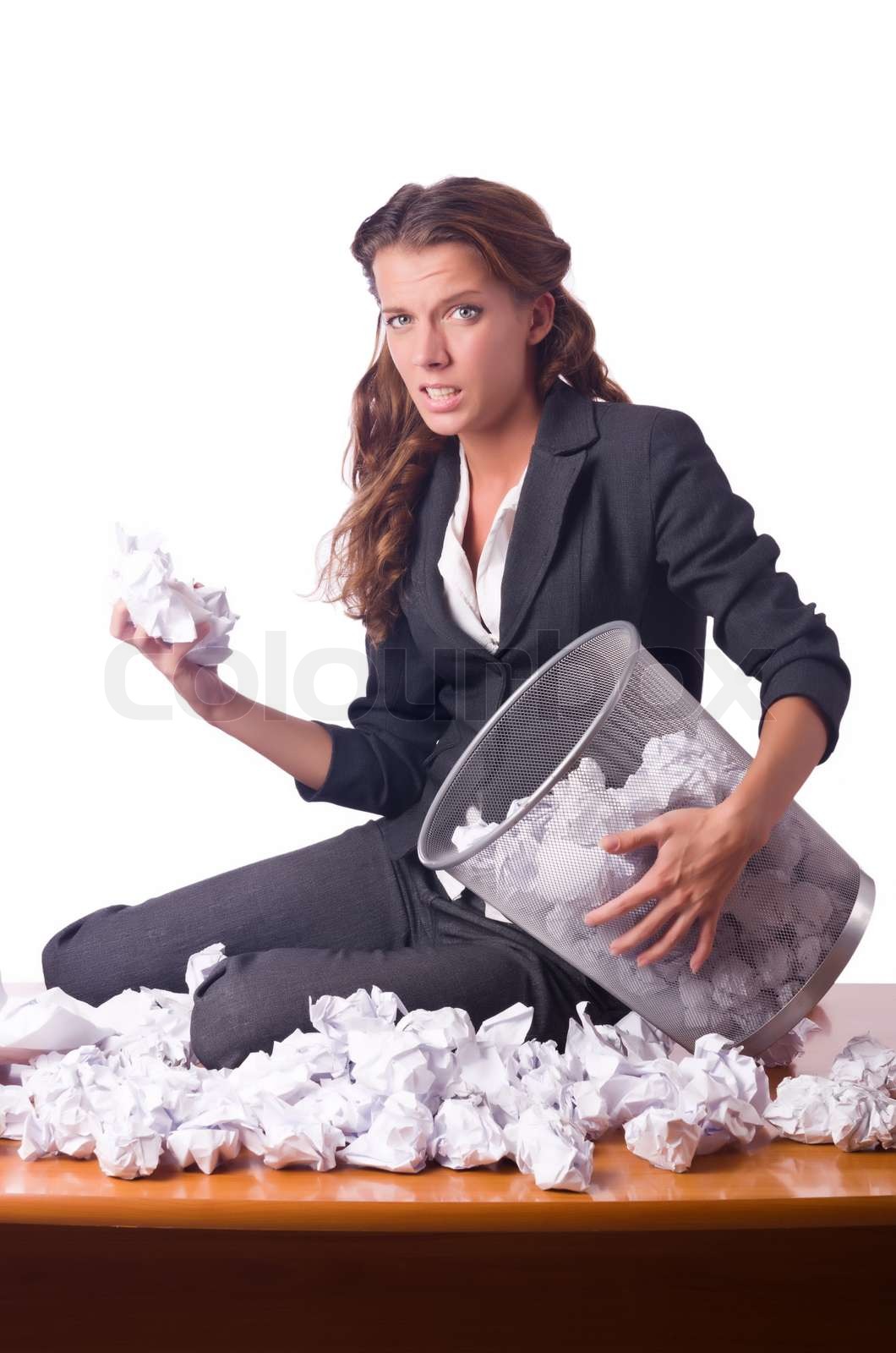 Woman with lots of discarded paper | Stock image | Colourbox