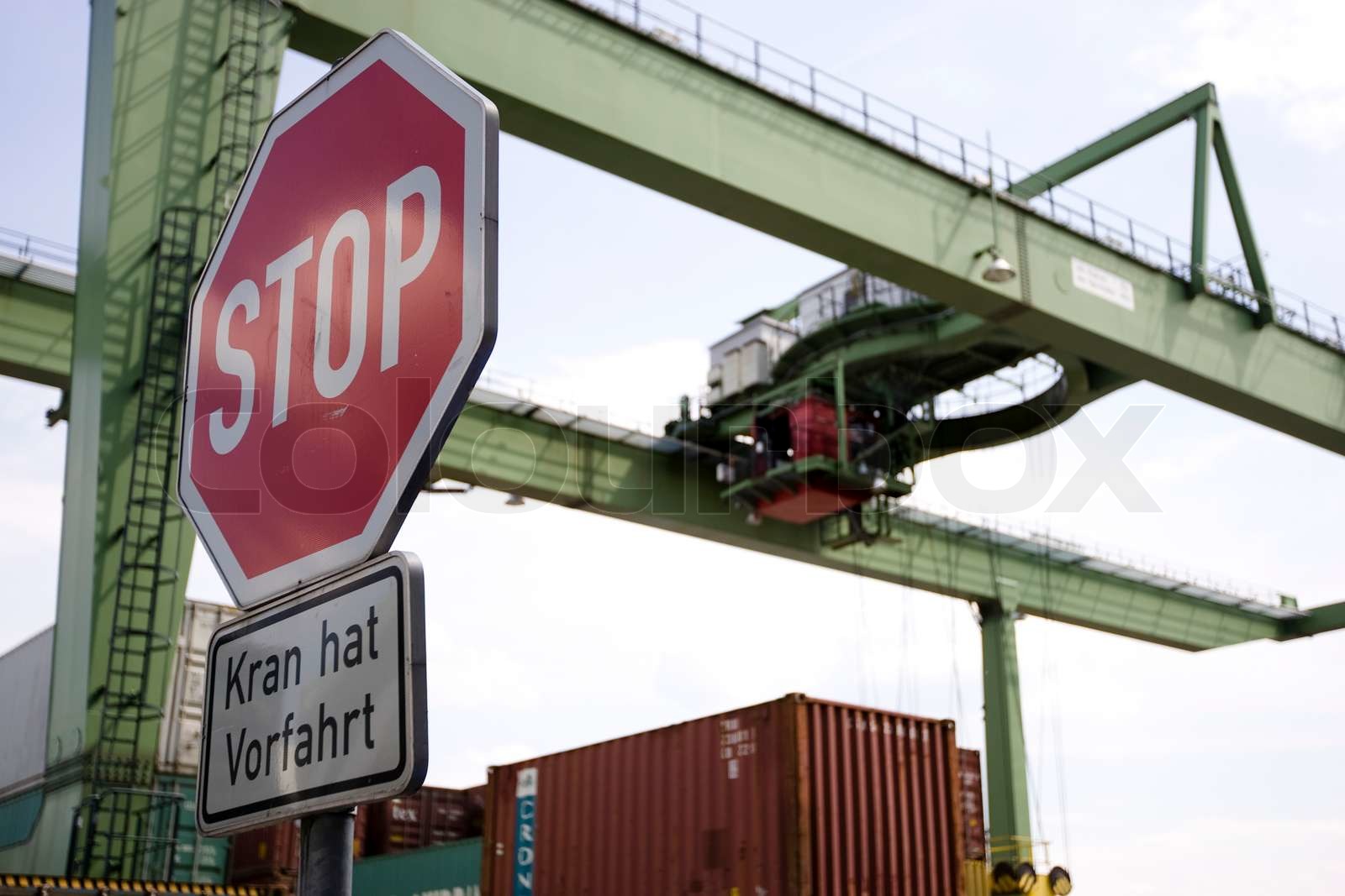 Stop sign in a container harbour | Stock image | Colourbox