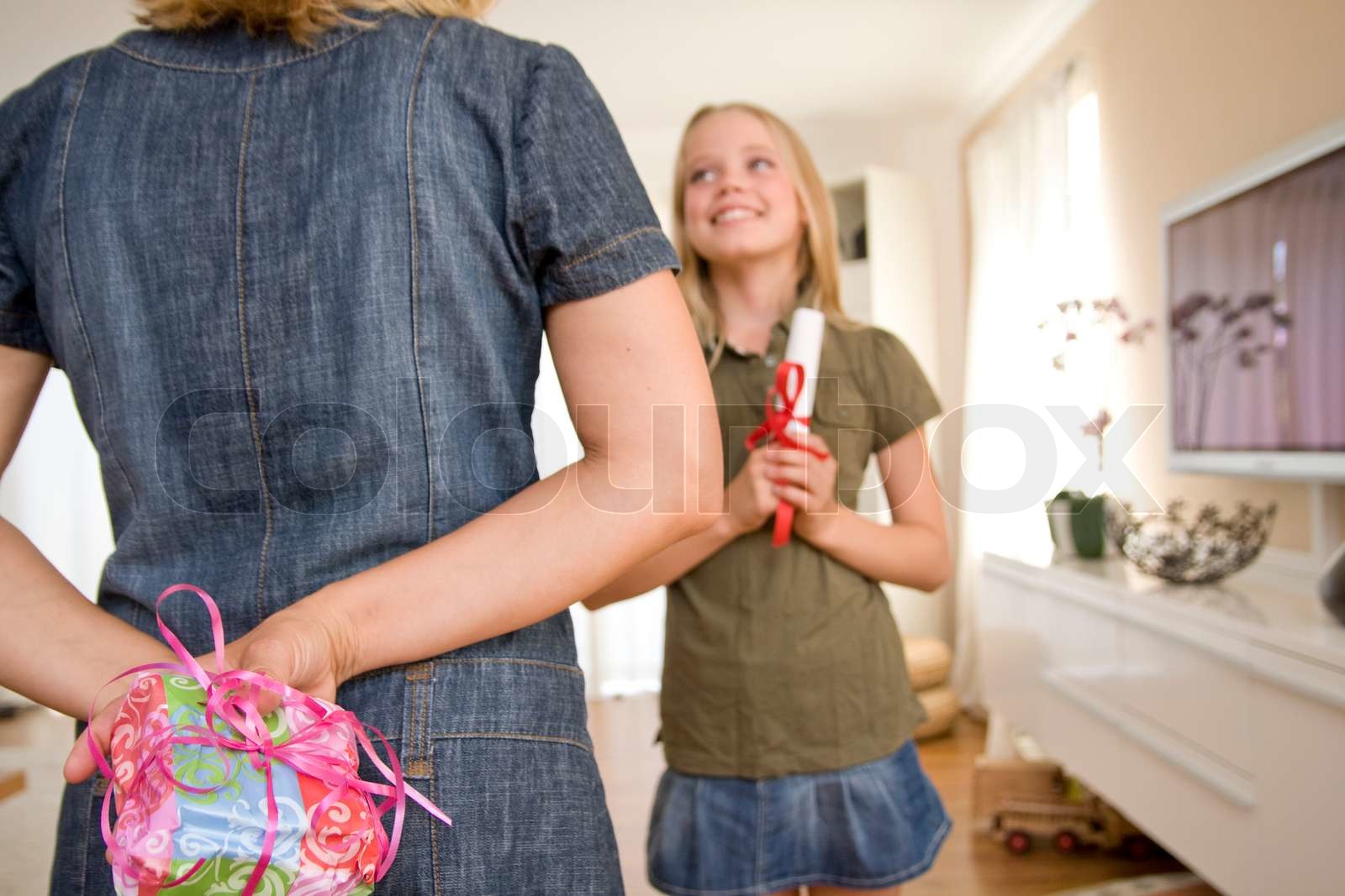 Surprise gift to a teenage girl with good school grades | Stock image ...