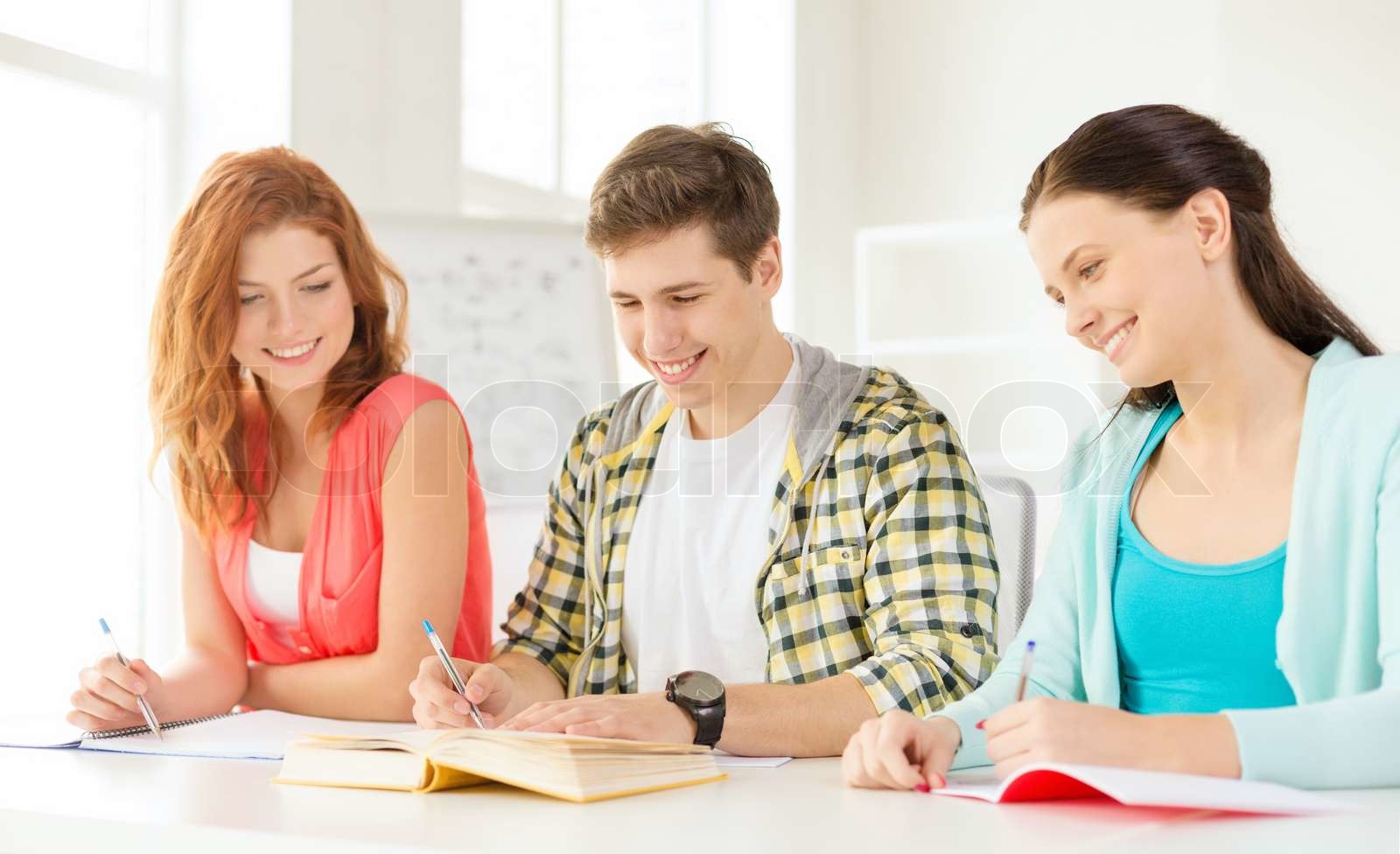 students with textbooks and books at school | Stock image | Colourbox
