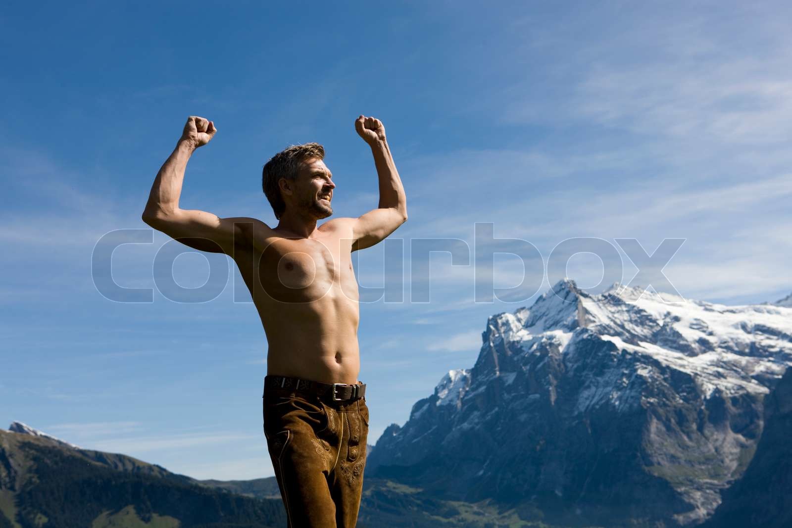 A confident man without his shirt on | Stock image | Colourbox
