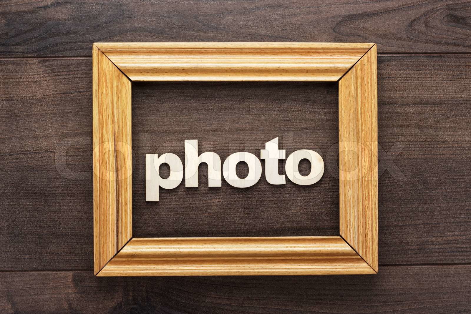 wooden frame with word photo on table | Stock image | Colourbox