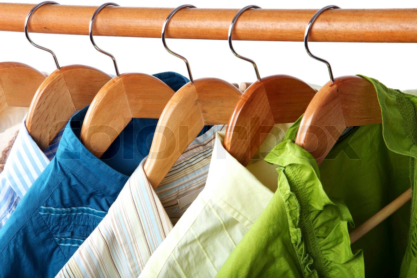 Fashion clothing on hangers at the show. | Stock image | Colourbox