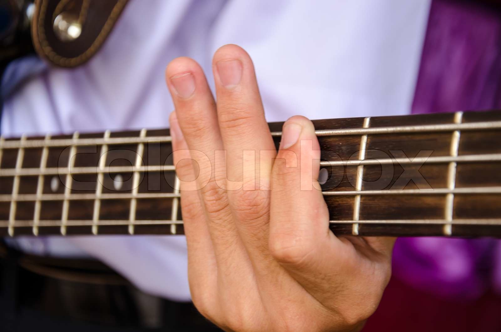 Hand for bass guitar | Stock image | Colourbox