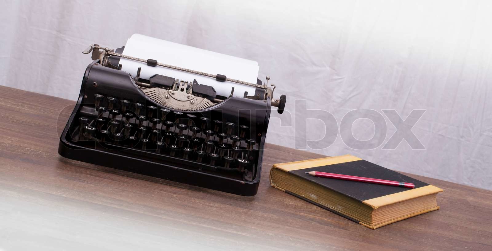 Vintage typewriter and old books | Stock image | Colourbox