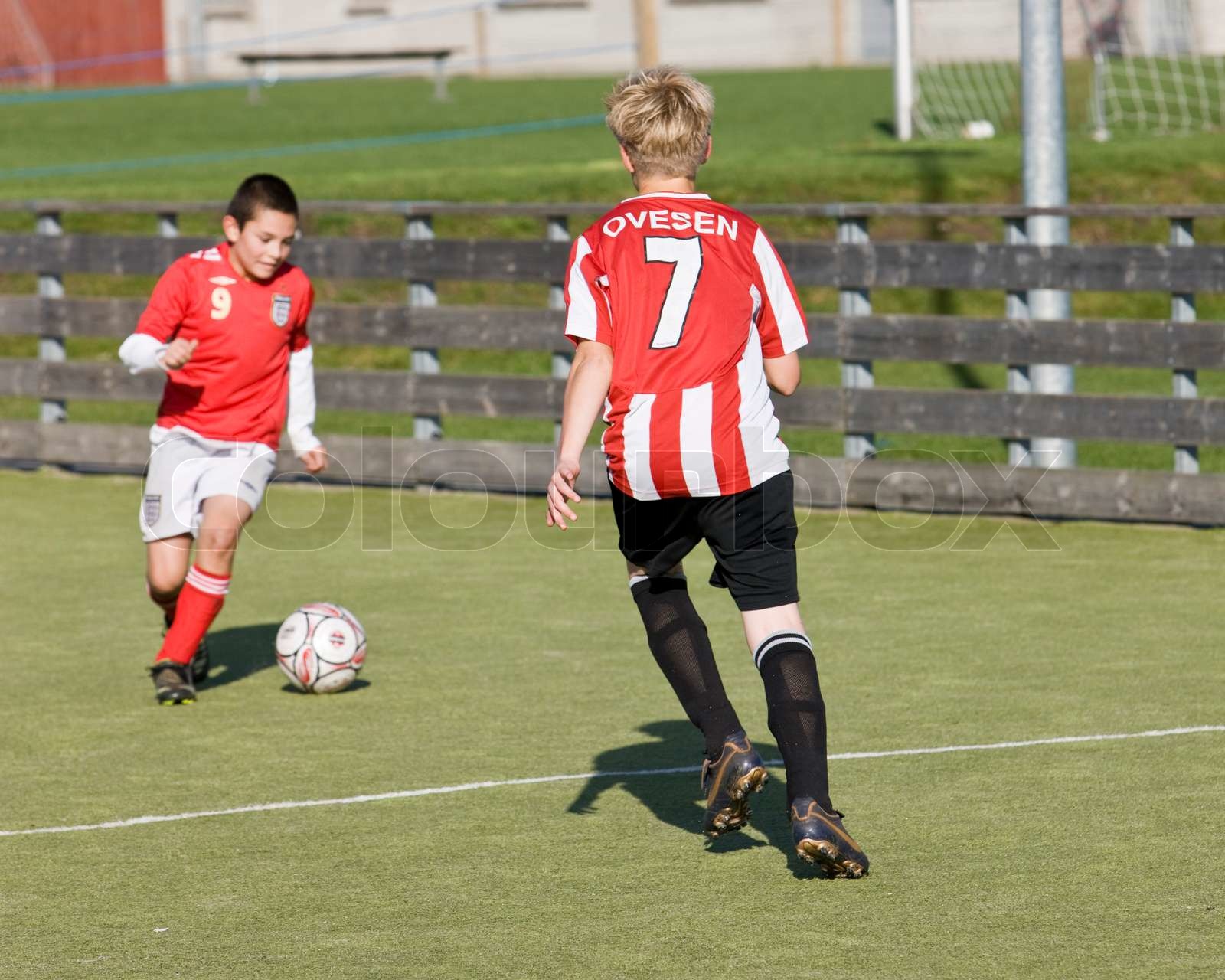 Young boys playing football | Stock image | Colourbox