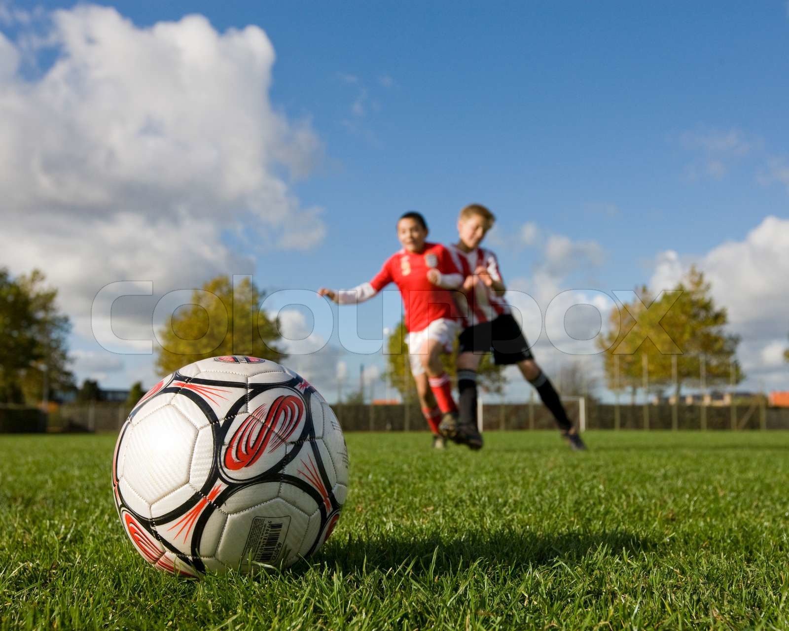 Young boys playing football | Stock image | Colourbox
