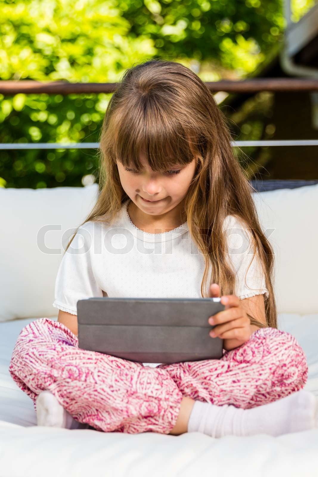 Girl with tablet | Stock image | Colourbox
