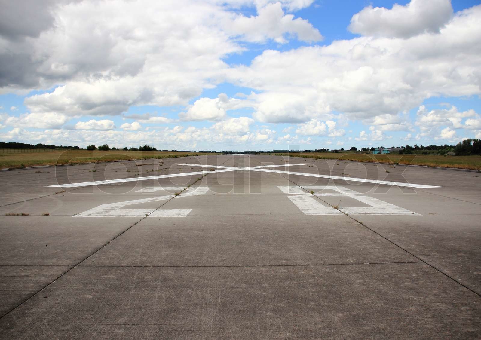 Airplane runway asphalt with number and cross | Stock image | Colourbox