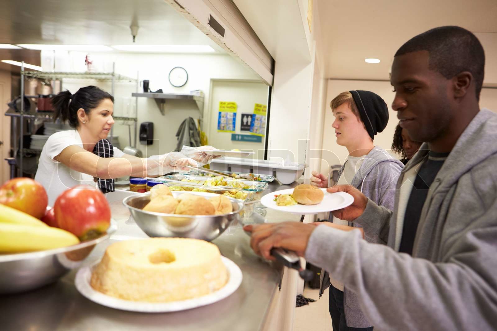 Kitchen Serving Food In Homeless Shelter | Stock image | Colourbox