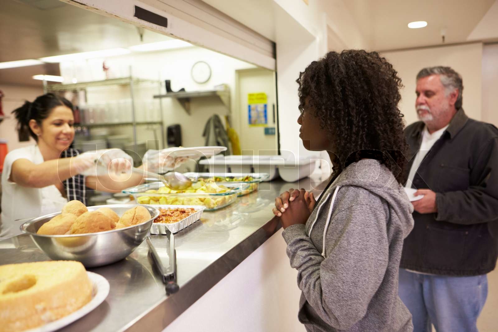 Kitchen Serving Food In Homeless Shelter | Stock image | Colourbox