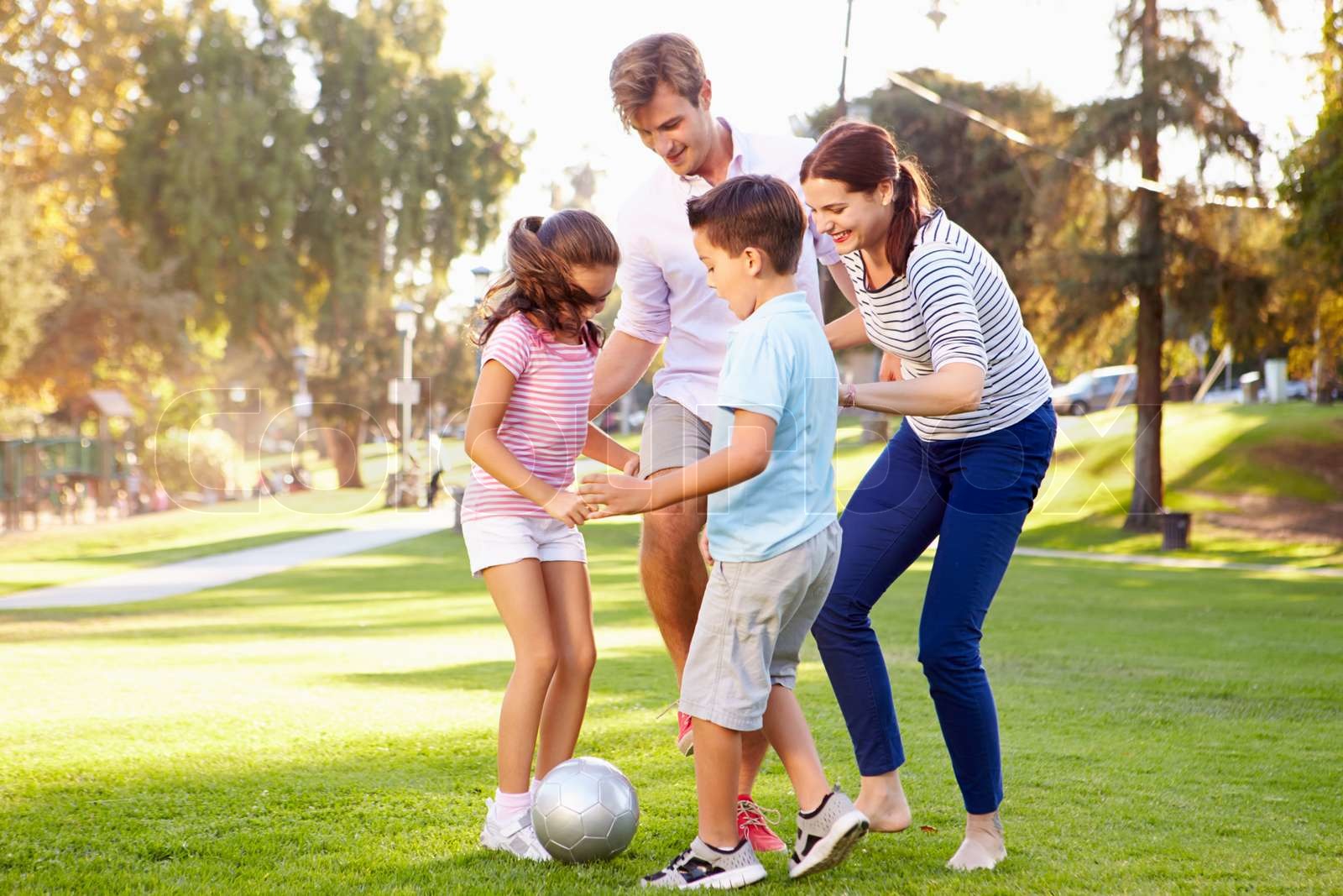 Family Playing Soccer In Park Together | Stock image | Colourbox