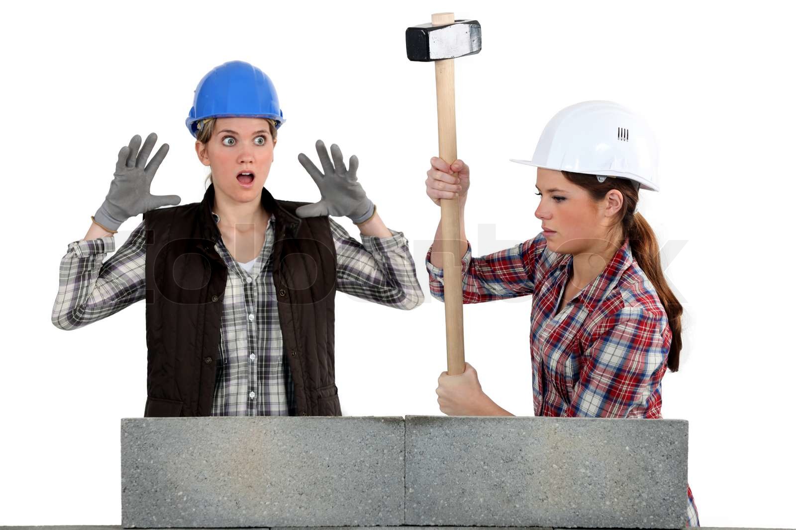 Women destroying a wall | Stock image | Colourbox