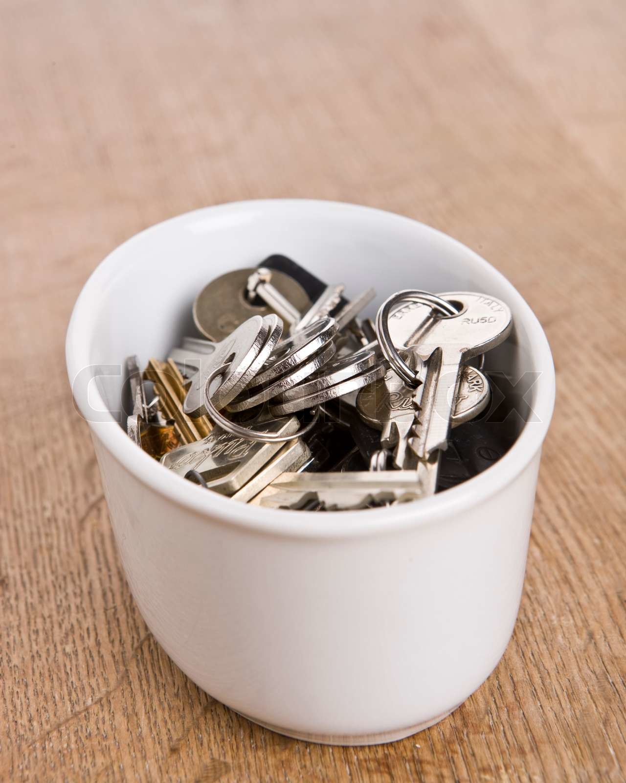 Collection of keys on a bowl | Stock image | Colourbox