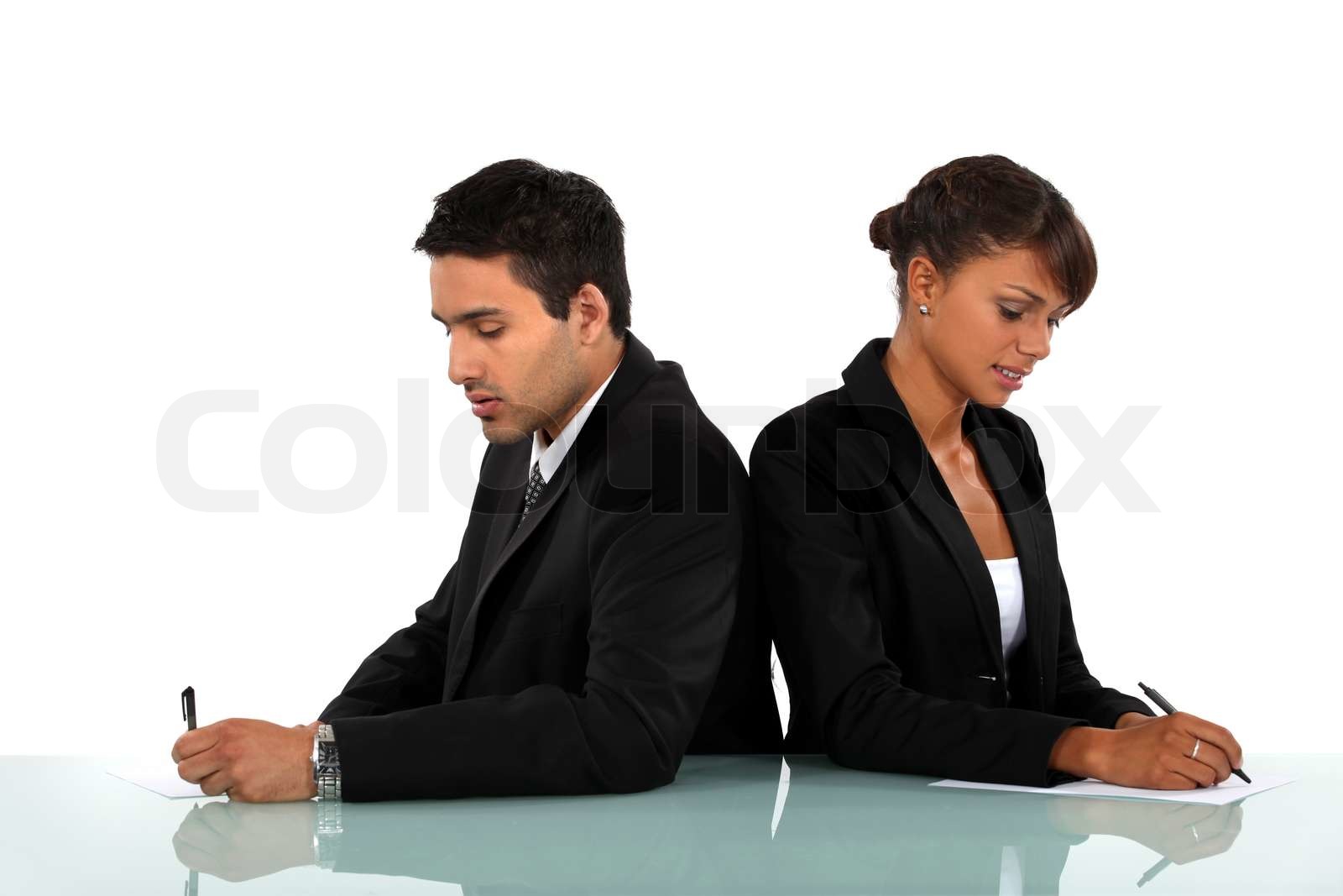 Business couple writing on forms | Stock image | Colourbox