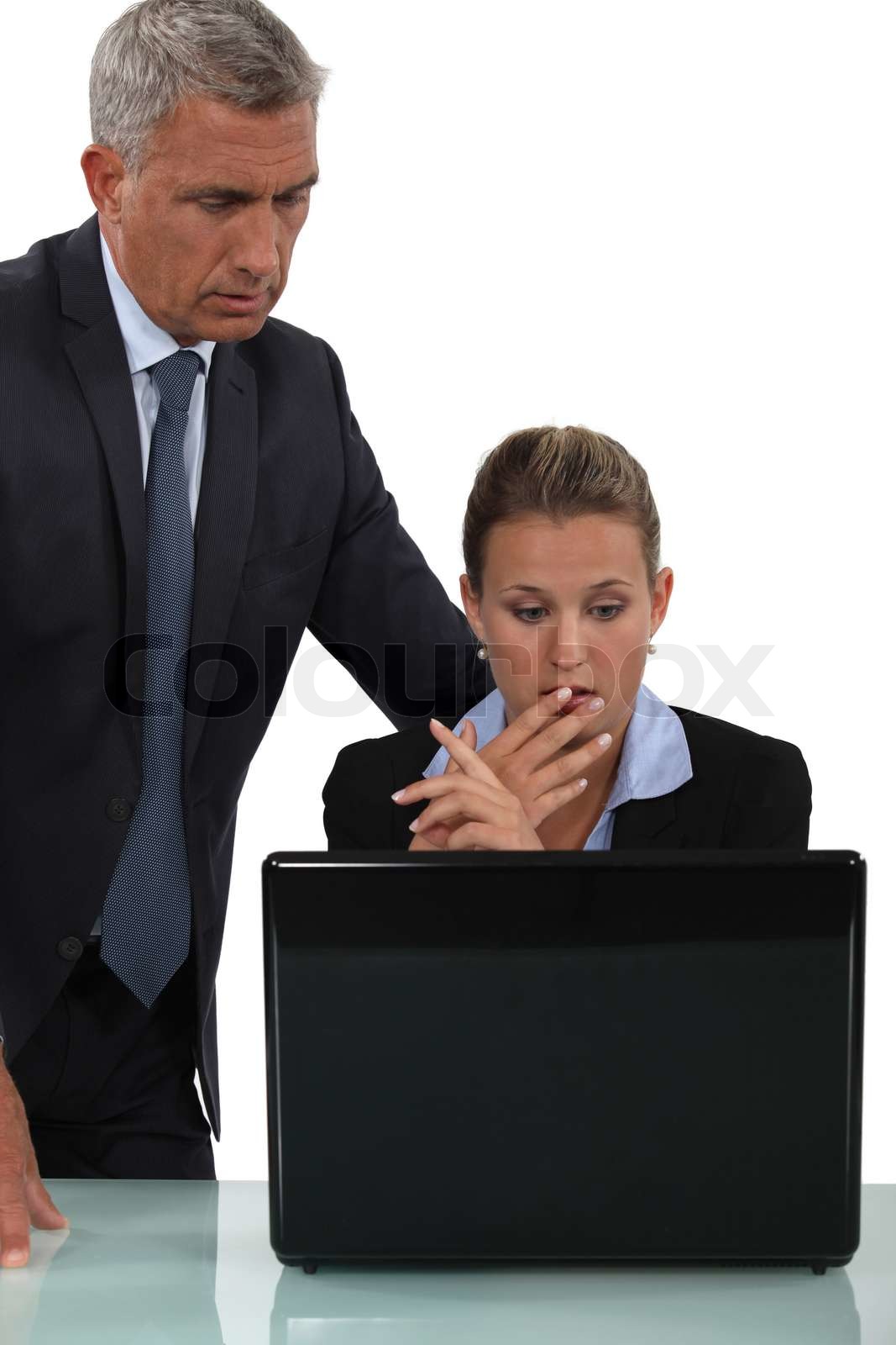 Boss reprimanding female employee | Stock image | Colourbox