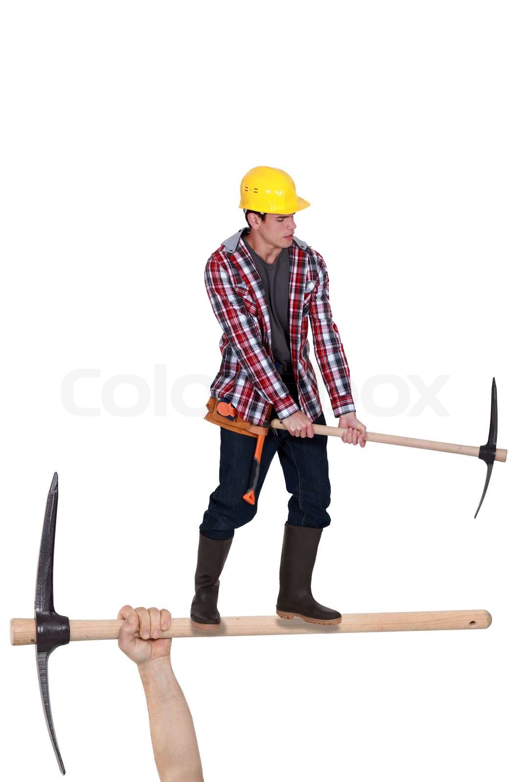 Worker with a pickaxe | Stock image | Colourbox