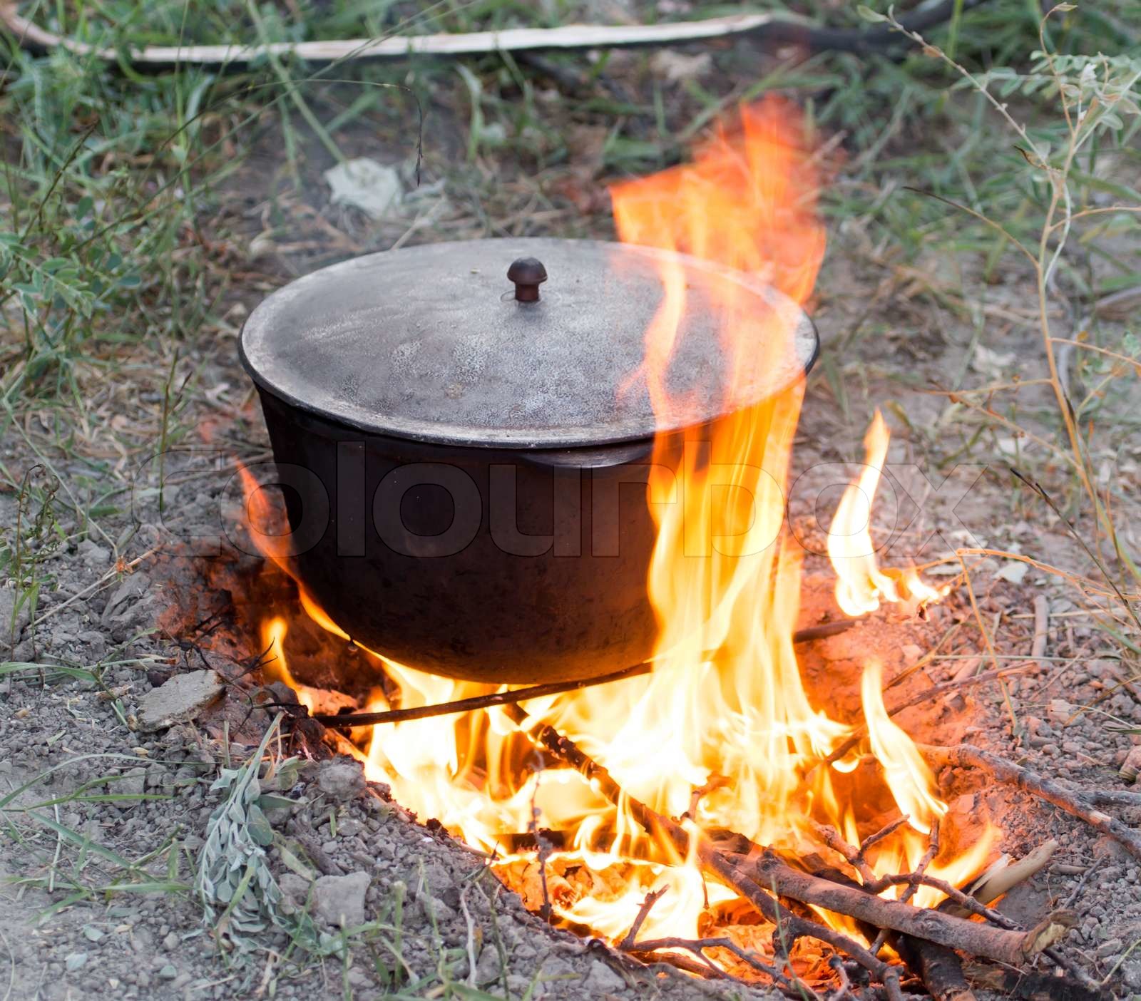 cauldron on the fire on the nature | Stock image | Colourbox