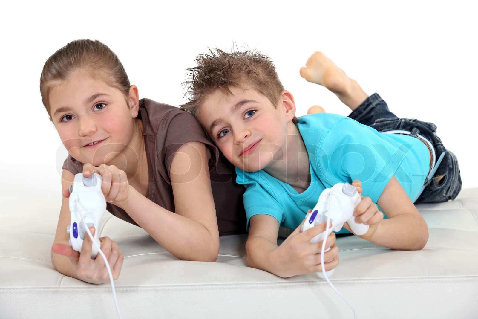 Brother and sister playing video games | Stock image | Colourbox