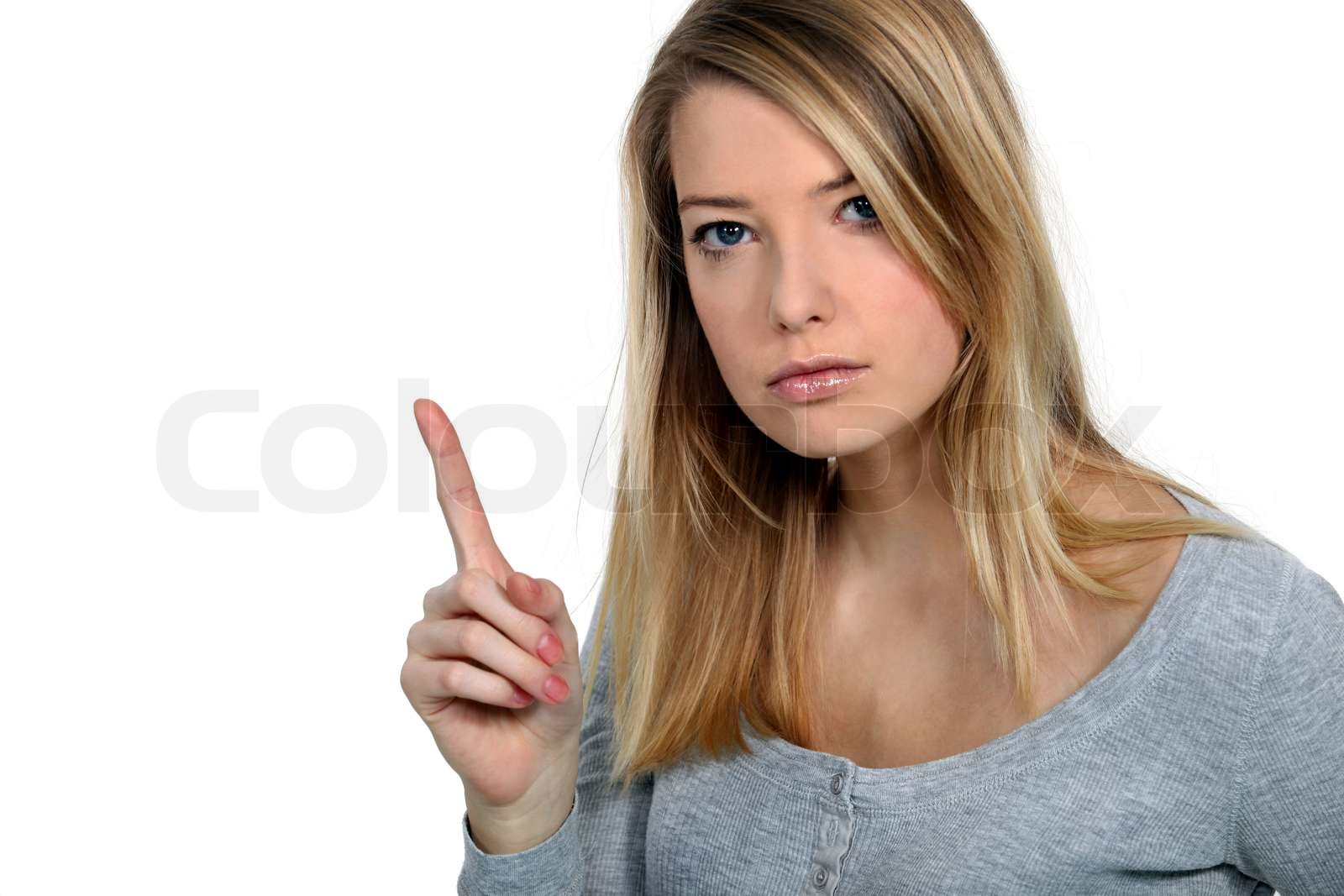 Stern woman wagging her finger | Stock image | Colourbox
