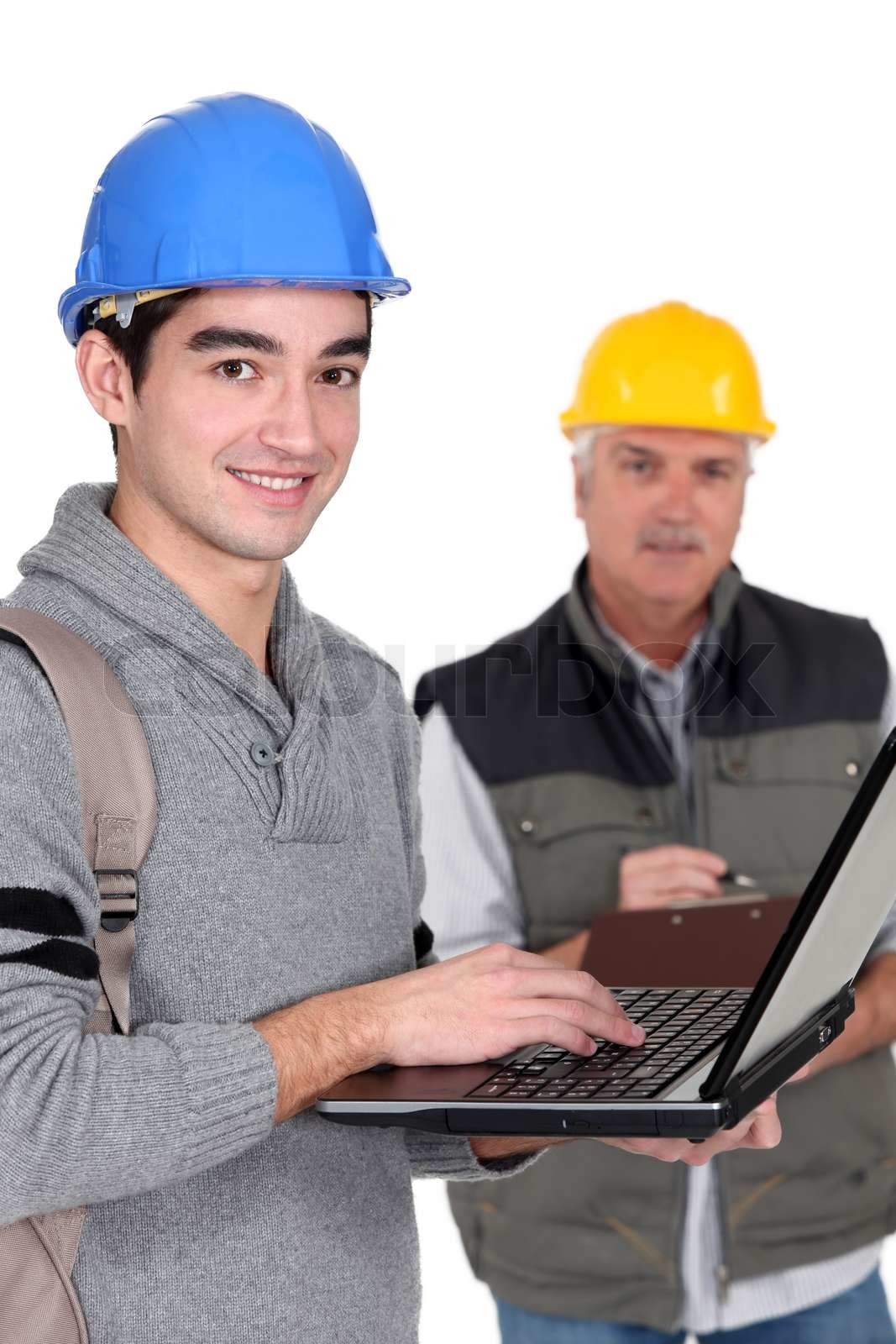 ein Azubi-Arbeiter mit einem Laptop. | Stock Bild | Colourbox