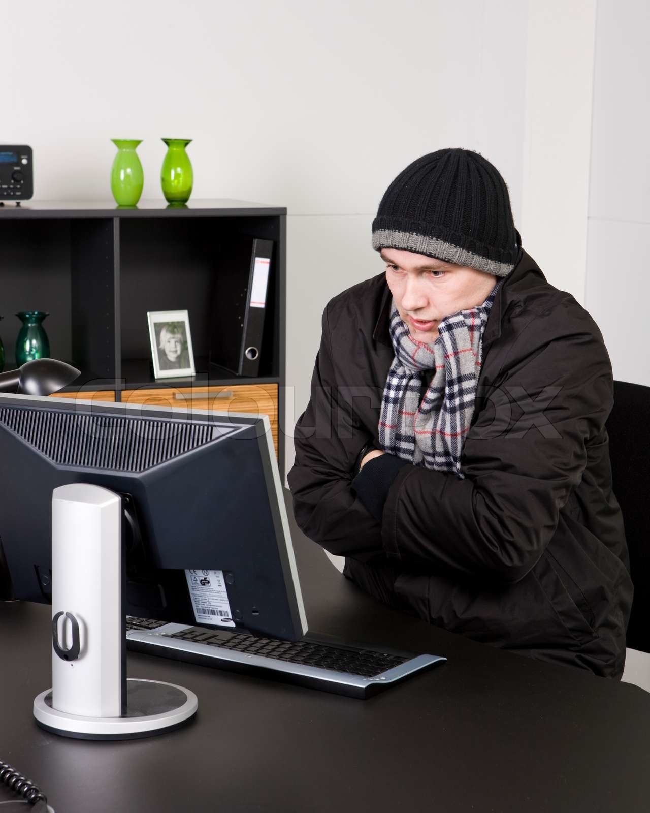 Man is frozen at the office | Stock image | Colourbox