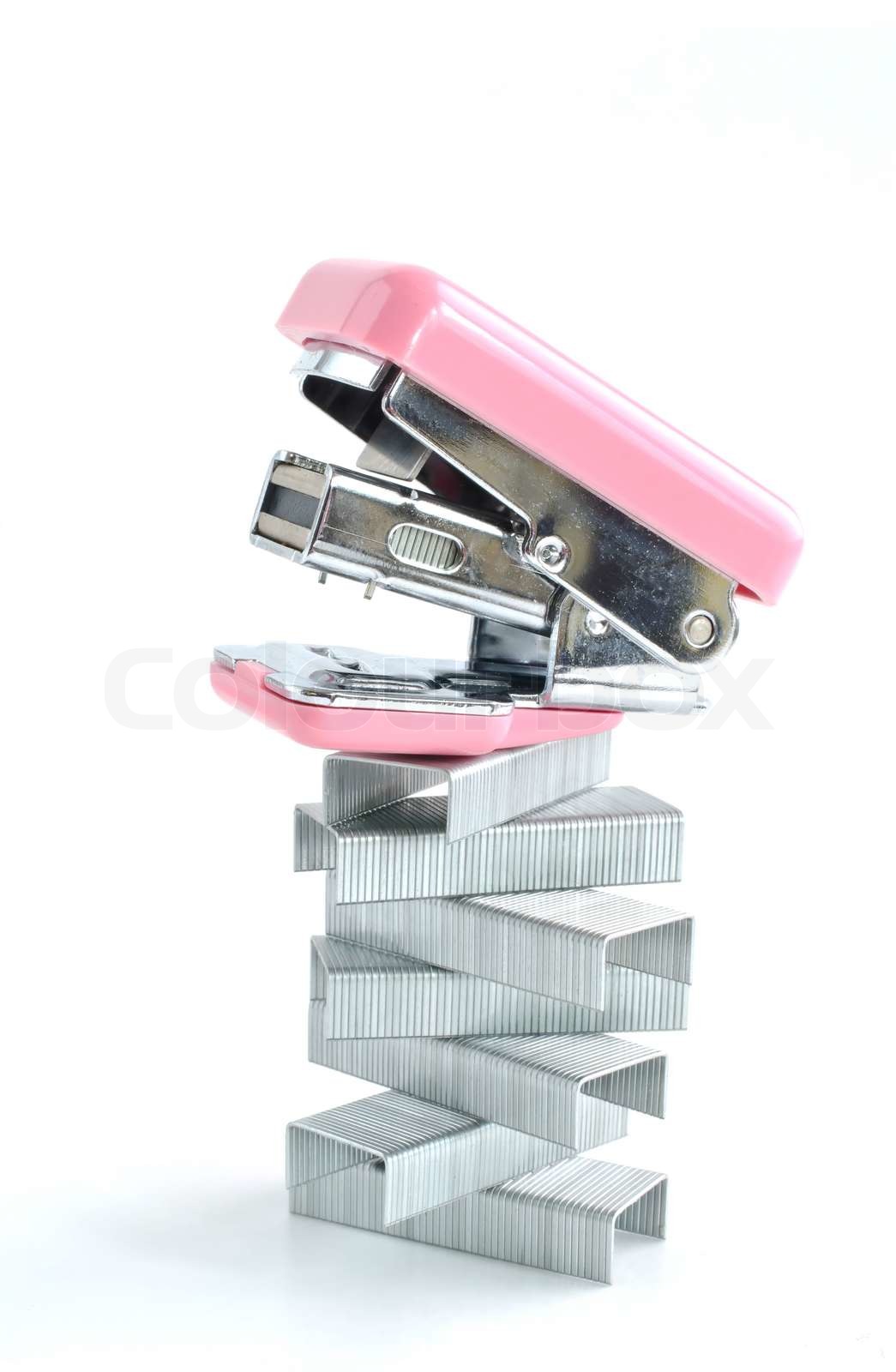 Pink stapler with staples stack | Stock image | Colourbox