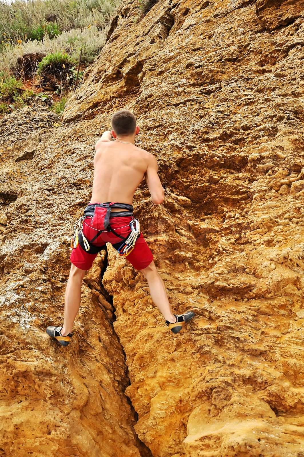 Young guy climbing | Stock image | Colourbox
