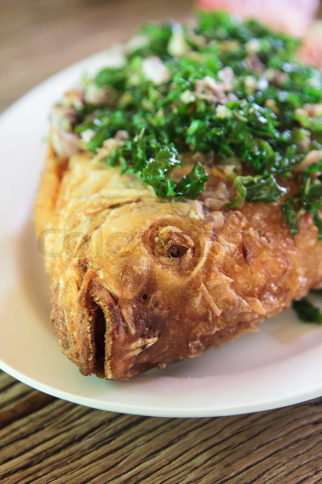Fried fish with herbs | Stock image | Colourbox