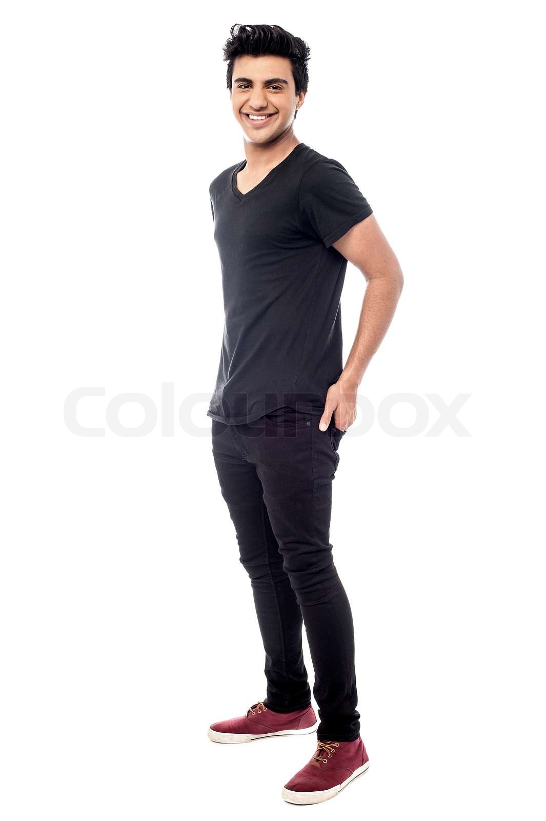 legerer Mann stehend mit den Händen hinter | Stock Bild | Colourbox