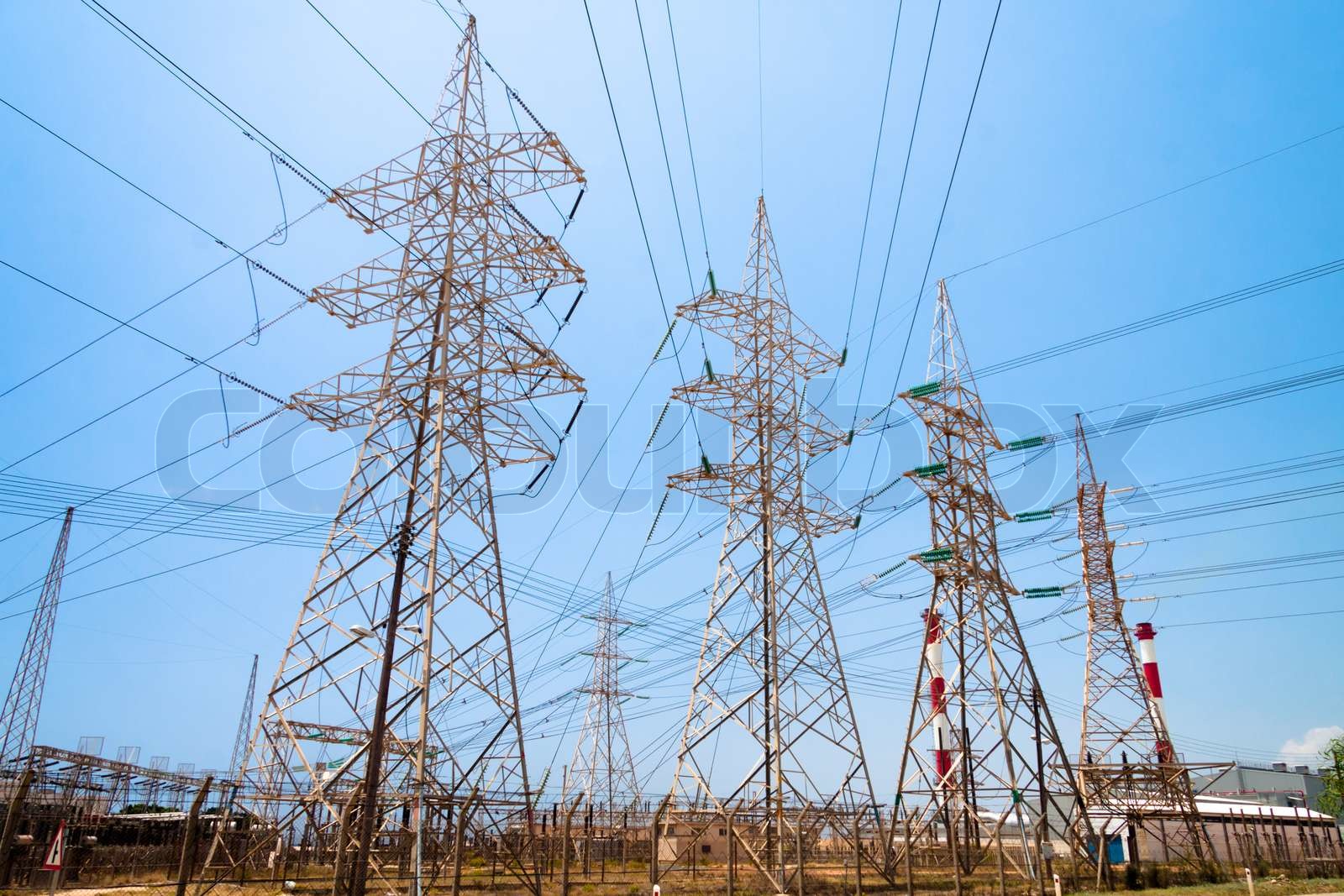 High-voltage power transmission towers. | Stock image | Colourbox