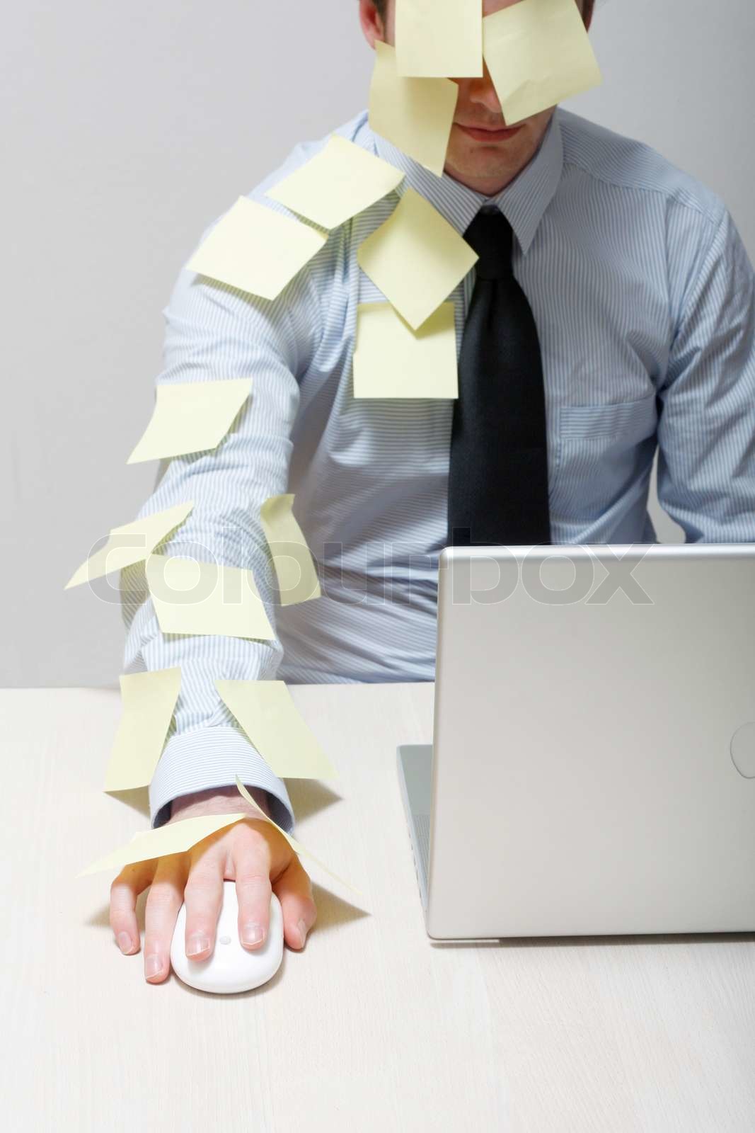 A businessman with post-it notes on his body | Stock image | Colourbox