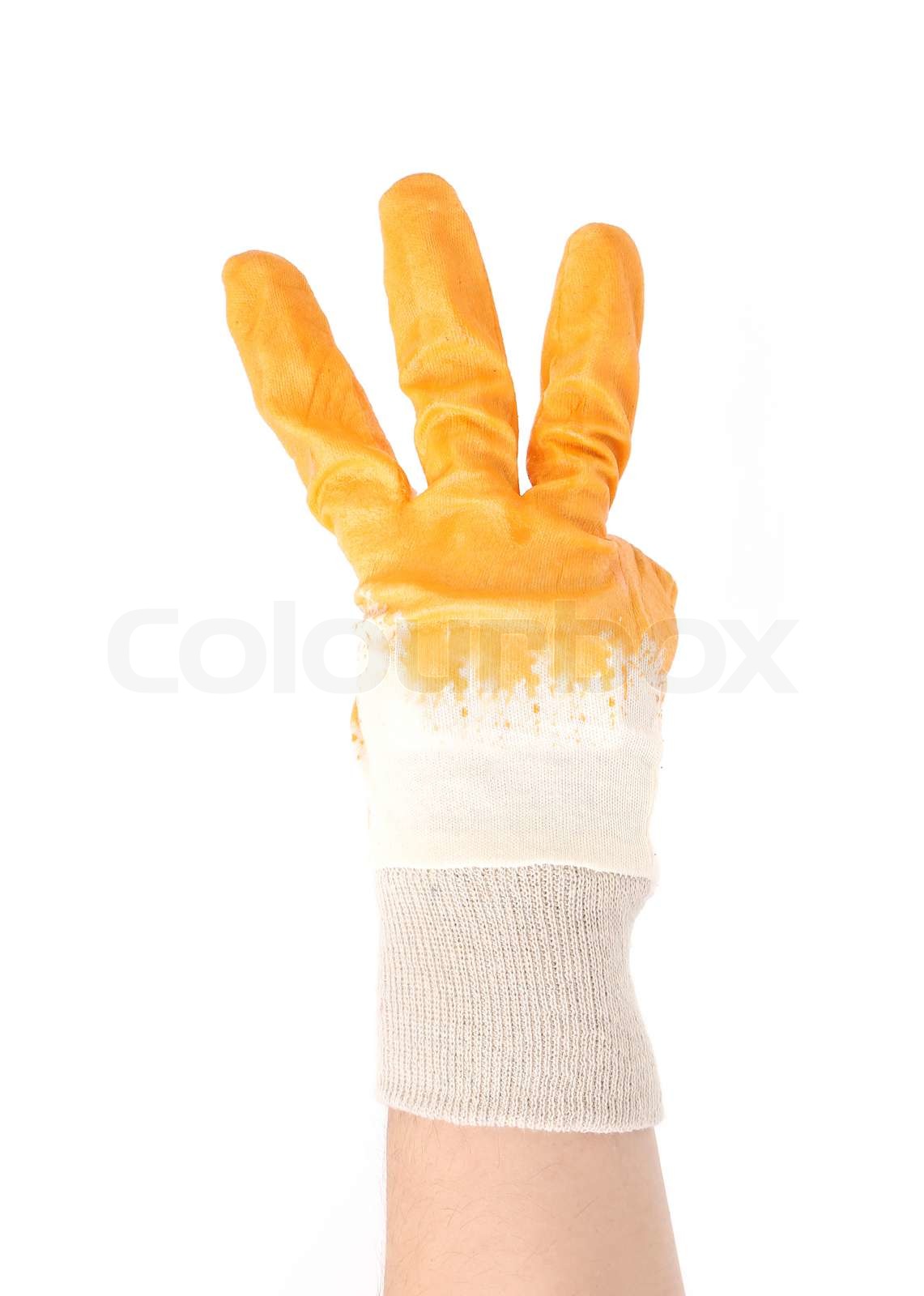 Gloved hand showing three fingers. | Stock image | Colourbox