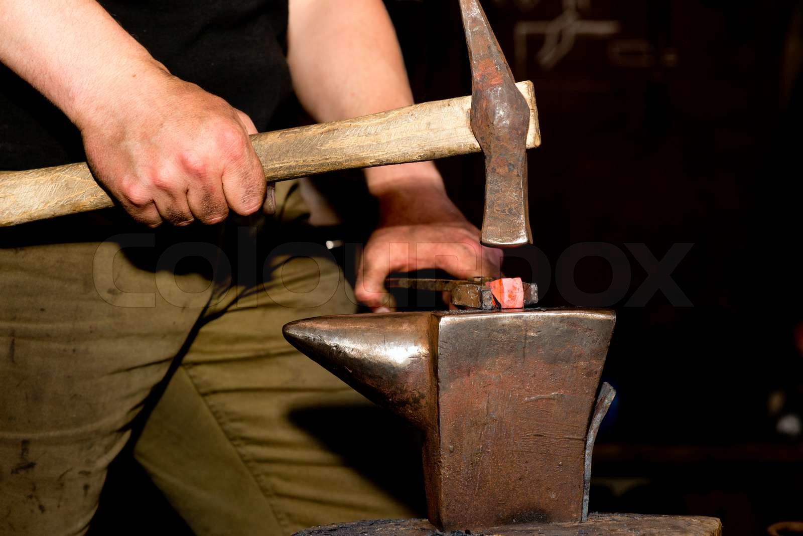 Ancient forging hammer and anvil | Stock image | Colourbox