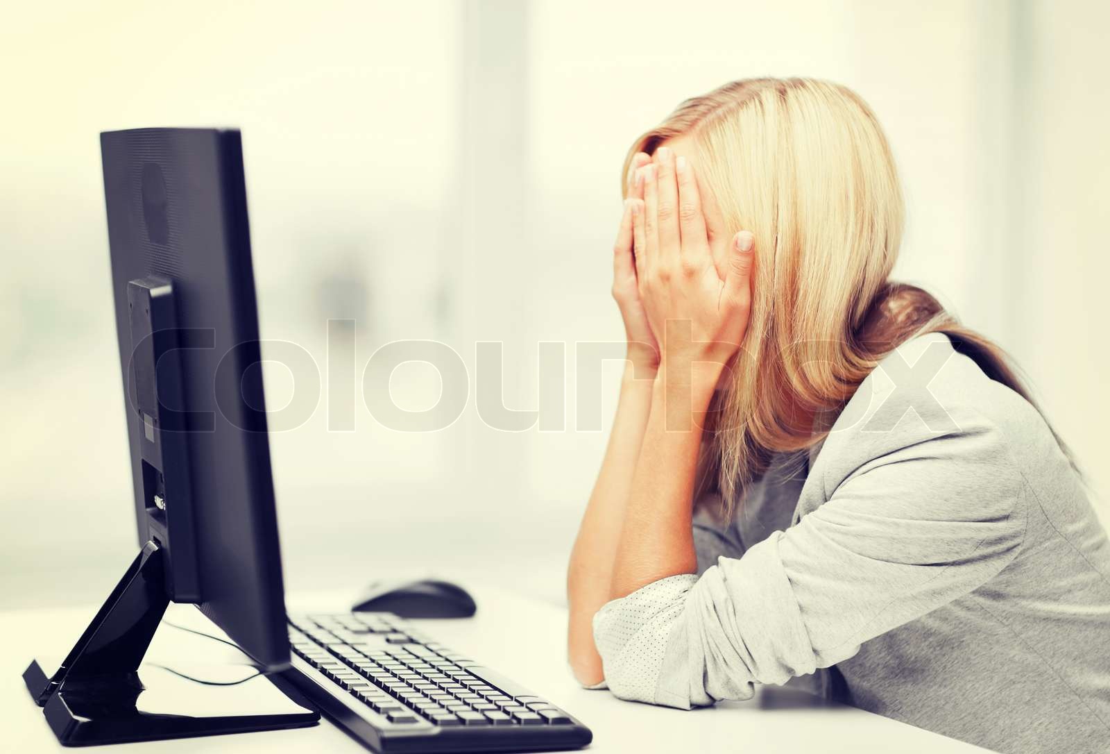 stressed woman with computer | Stock image | Colourbox