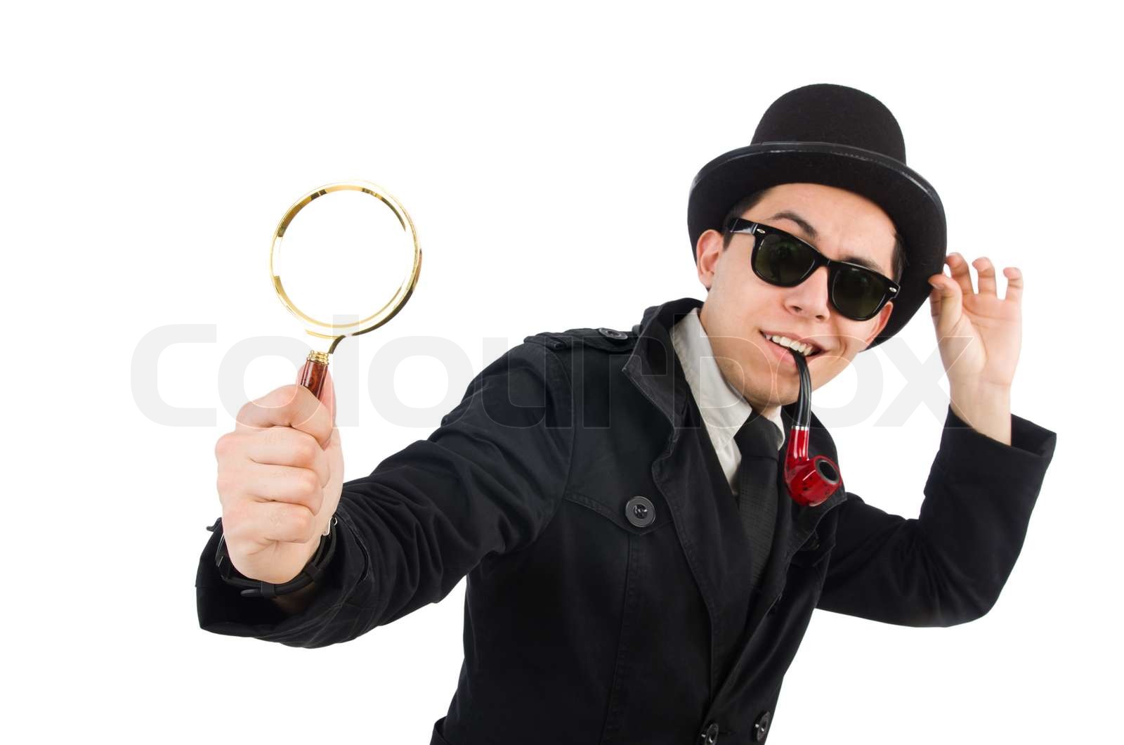 Young detective with pipe and magnifying glass | Stock image | Colourbox