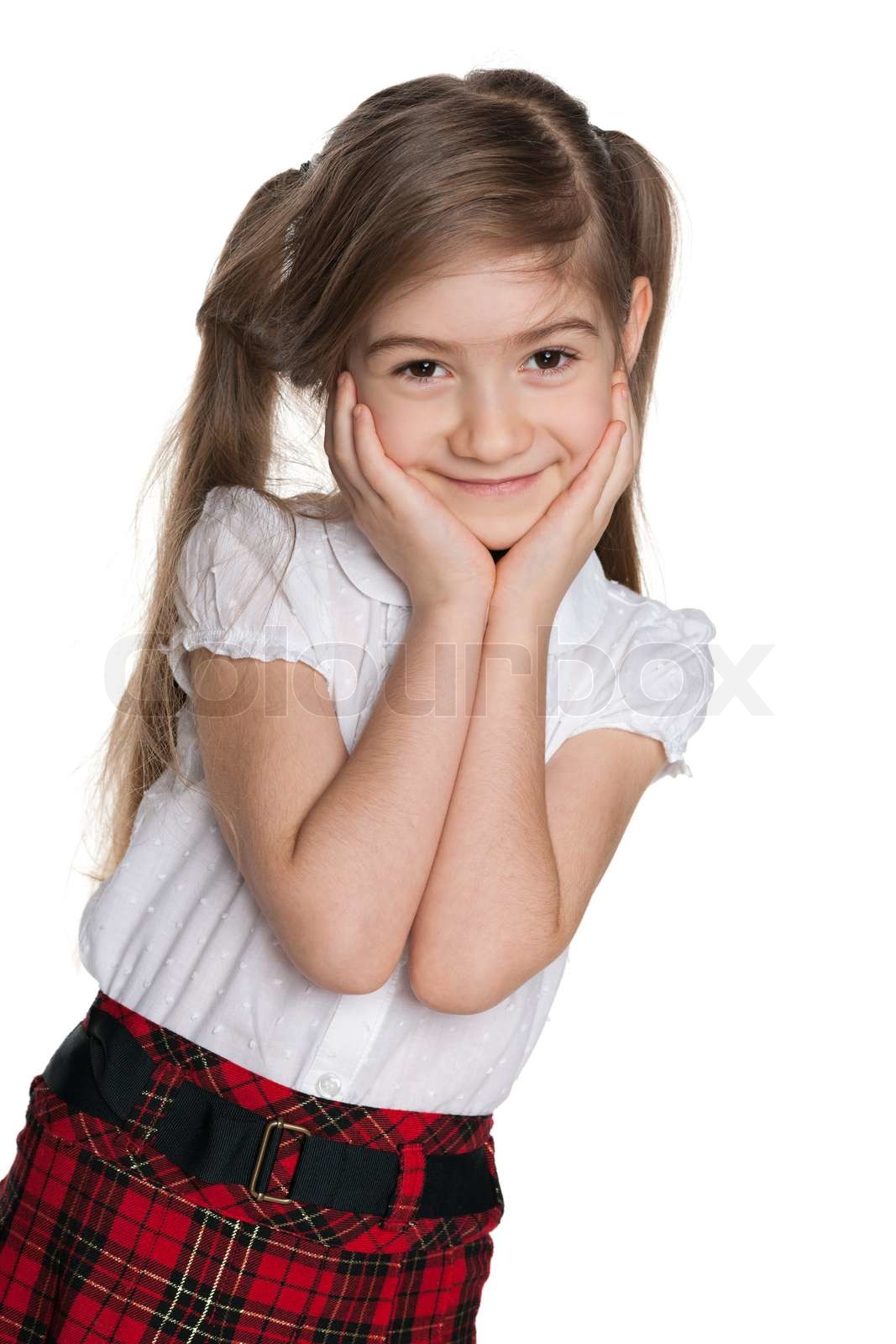 Portrait of a shy little girl | Stock image | Colourbox