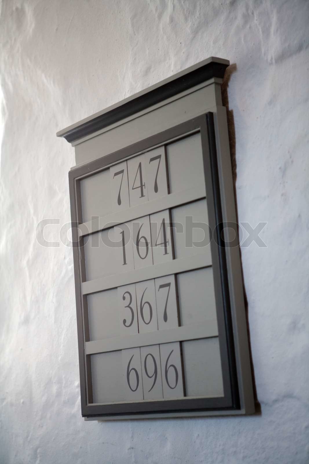 Church wall with hymn numbers | Stock image | Colourbox