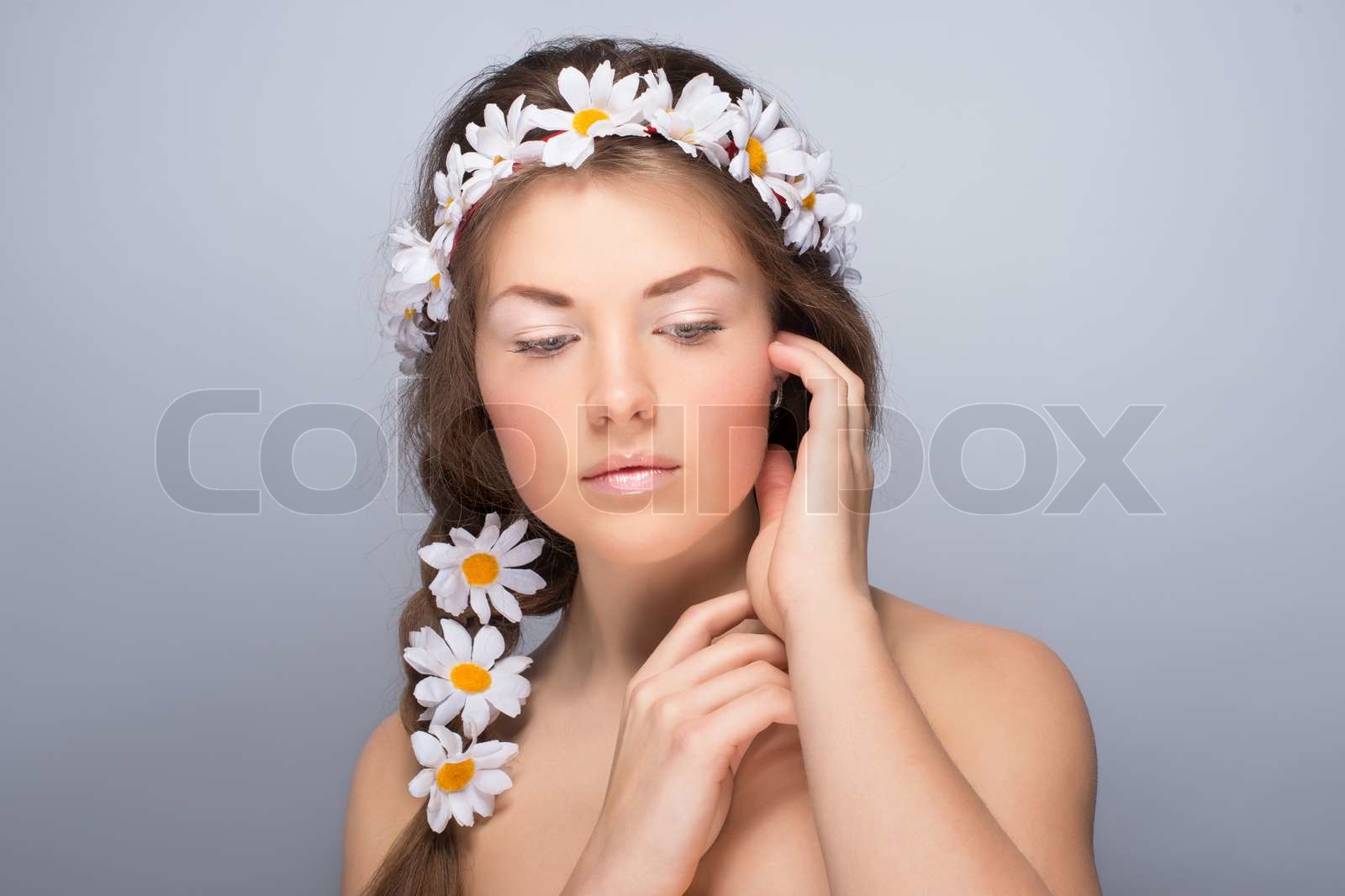 Сlose Portrait Of Beautiful Naked Girl With Light Makeup And Flowers