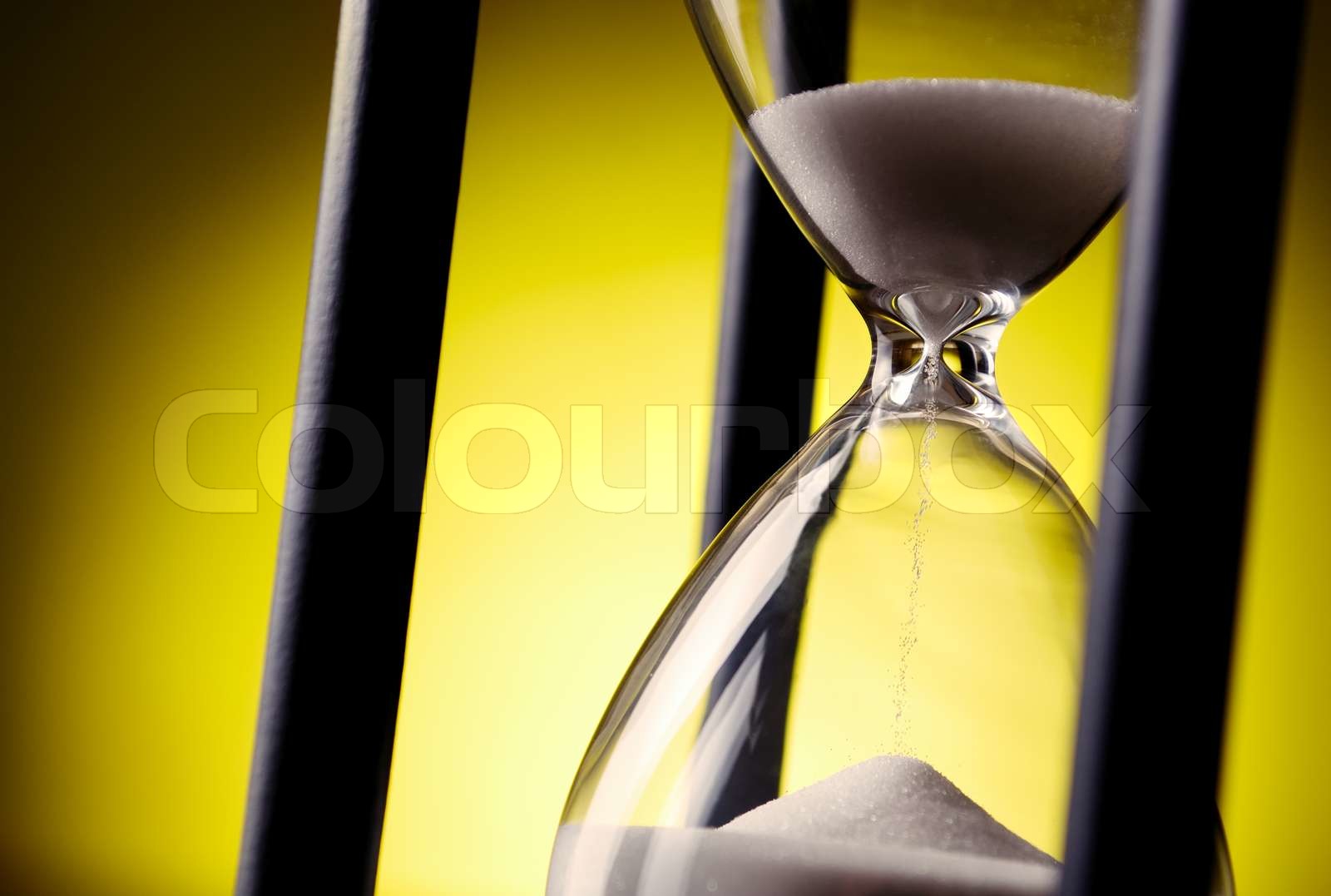 Hourglass counting down the time | Stock image | Colourbox