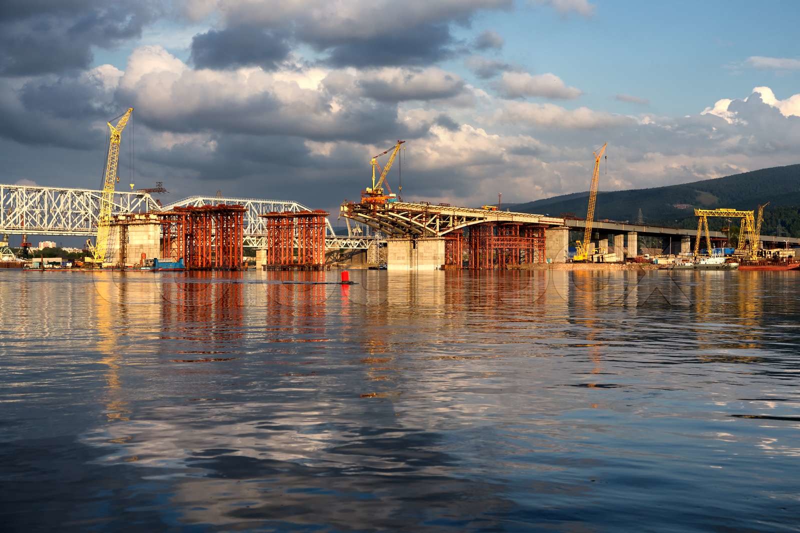 Building a road bridge across river | Stock image | Colourbox