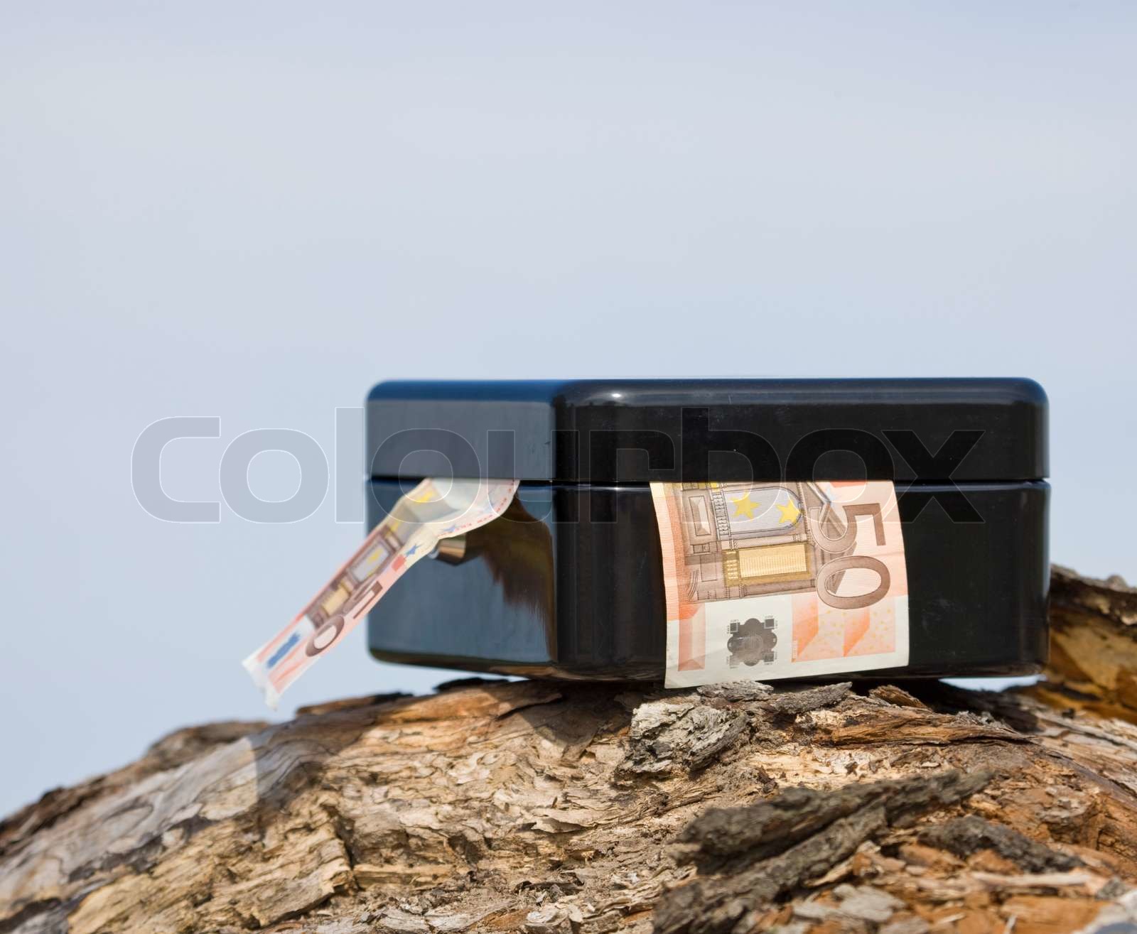 Black cash box with euro bills | Stock image | Colourbox