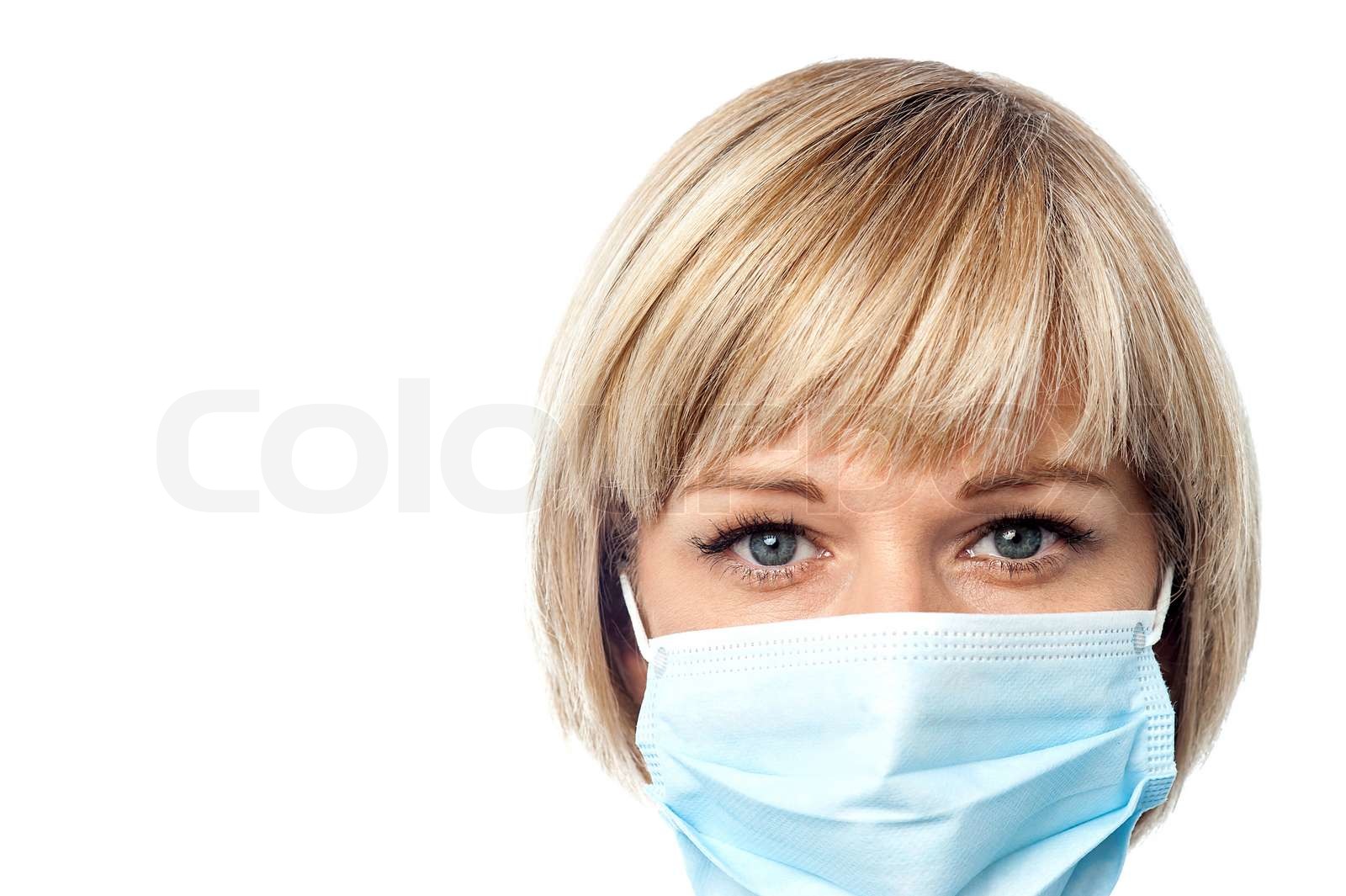 Female doctor wearing surgical mask | Stock image | Colourbox