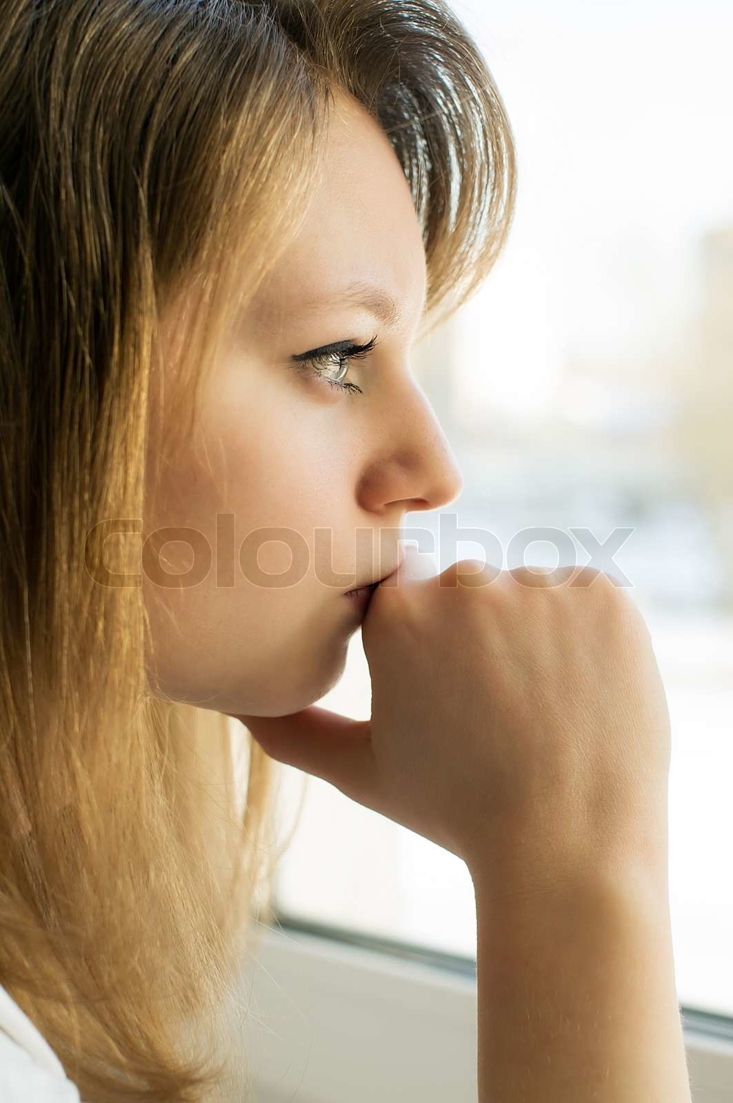 Sad Girl Looking Out The Window Stock Image Colourbox